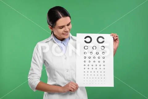 Ophthalmologist with vision test chart on green background ~ Hi Res ...