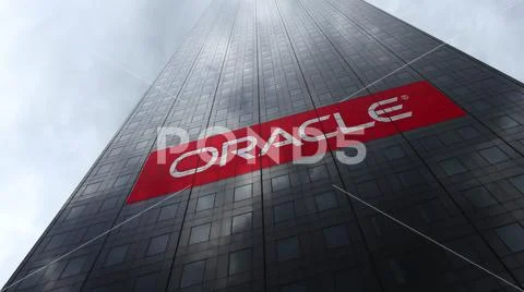Oracle Corporation logo on a skyscraper facade reflecting clouds ...
