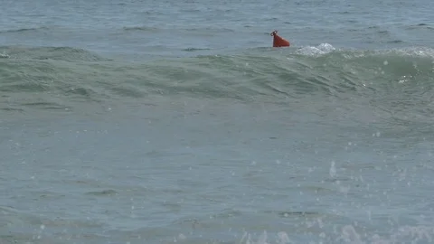 Orange beacon signaling that floats thro... | Stock Video | Pond5