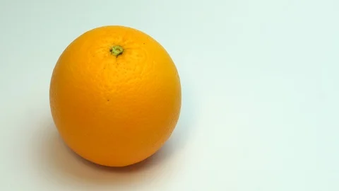 orange fruit rotating on white backgroun... | Stock Video | Pond5