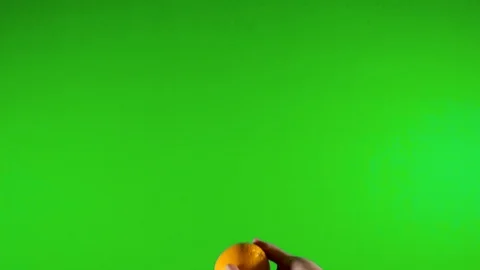 orange with green background throwing up... | Stock Video | Pond5