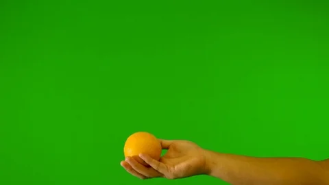 orange with green background throwing up... | Stock Video | Pond5