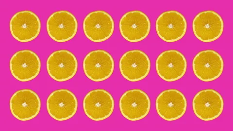 Orange halves animated against a pink ba... | Stock Video | Pond5