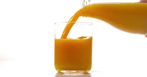 Orange Juice being poured into Glass aga... | Stock Video | Pond5