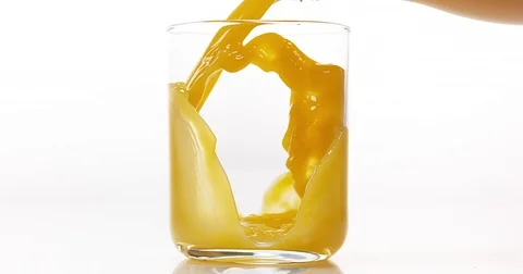 Orange Juice being poured into Glass aga... | Stock Video | Pond5