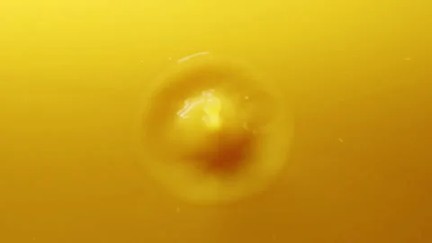 Orange juice drop falling down, dripping... | Stock Video | Pond5