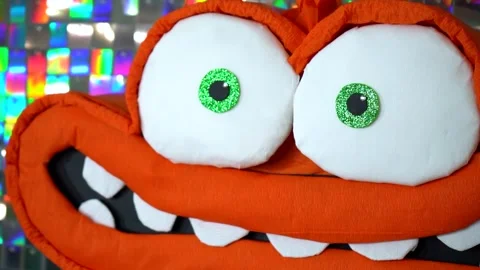 Orange piñata character with big eyes a... | Stock Video | Pond5