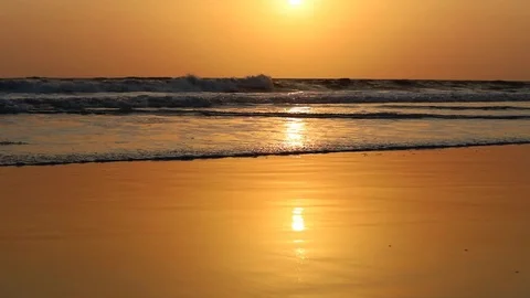 Orange sunset on the ocean. Girls sad go... | Stock Video | Pond5