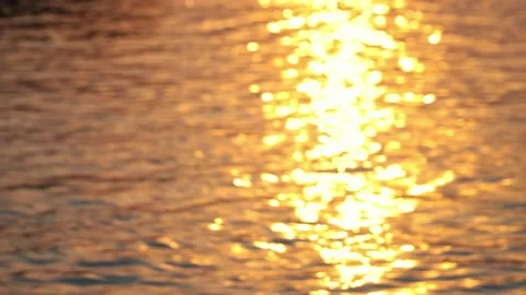 The orange water glinting at sunset | Stock Video | Pond5