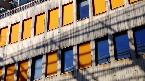Orange window shades and timber cladding... | Stock Video | Pond5