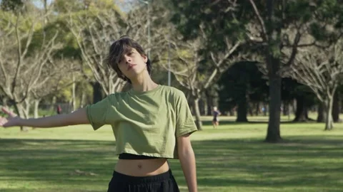 Orbit shot of a woman stretching her cer... | Stock Video | Pond5