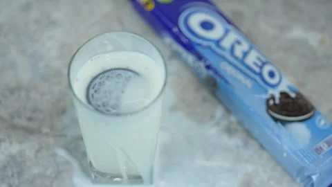 Oreo with milk. The famous blue packagin... | Stock Video | Pond5