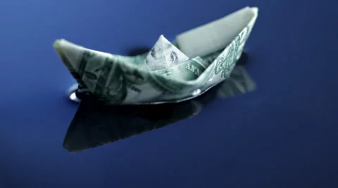 Origami boat made of dollar bill floatin... | Stock Video | Pond5