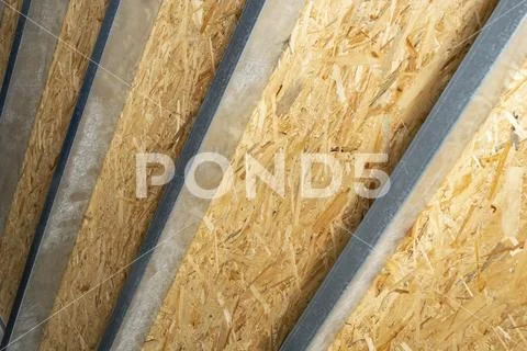 Osb roofing with metal beams ceiling, abstract texture ~ Hi Res #253887173