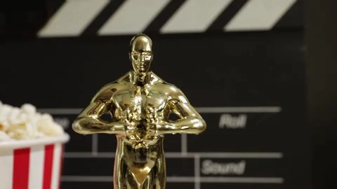 Oscar award, trophy statue with popcorn ... | Stock Video | Pond5