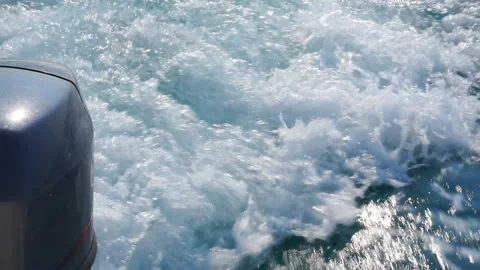 Outboard motor creates waves on the surf... | Stock Video | Pond5