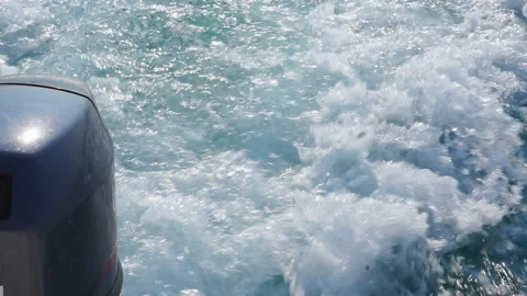 Outboard motor creates waves on the surf... | Stock Video | Pond5