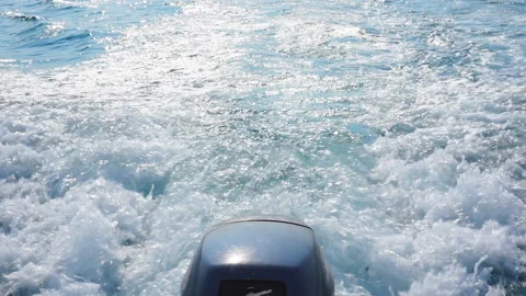 Outboard motor creates waves on the surf... | Stock Video | Pond5