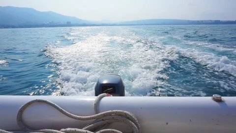 Outboard motor creates waves on the surf... | Stock Video | Pond5