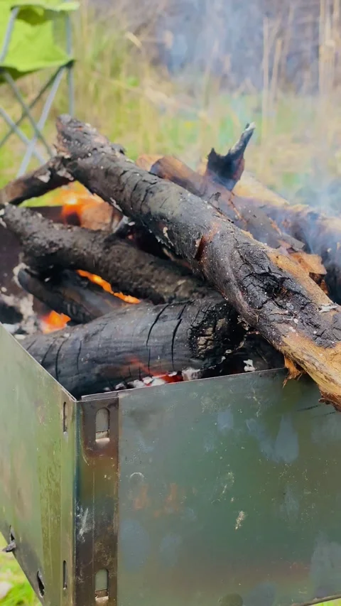 Outdoor campfire pit in action, surround... | Stock Video | Pond5