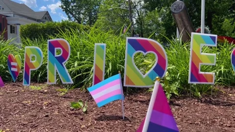 outdoor PRIDE day signage with LGBTQ fla... | Stock Video | Pond5