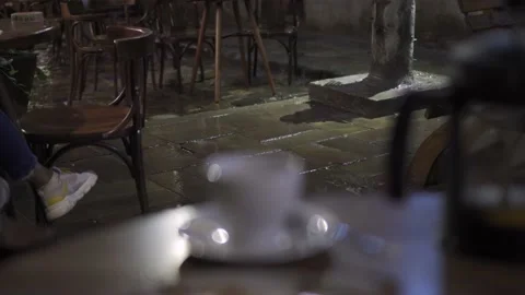 Outdoor street cafe at night in rain. Un... | Stock Video | Pond5