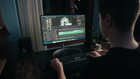 Over the shoulder shot of a boy editing ... | Stock Video | Pond5