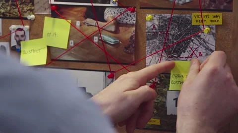 Over-the-shoulder shot of a detective af... | Stock Video | Pond5