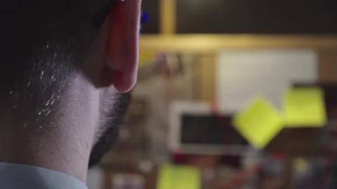 Over-the-shoulder shot of a detective ta... | Stock Video | Pond5