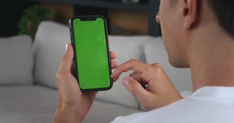 Over the shoulder shot male hand holding... | Stock Video | Pond5