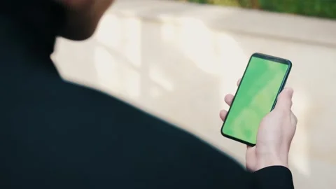 Over the shoulder shot of man using a ph... | Stock Video | Pond5