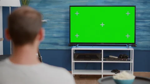 Over shoulder view of man watching movie... | Stock Video | Pond5