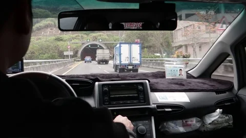 Over the shoulder view of taxi a driver,... | Stock Video | Pond5