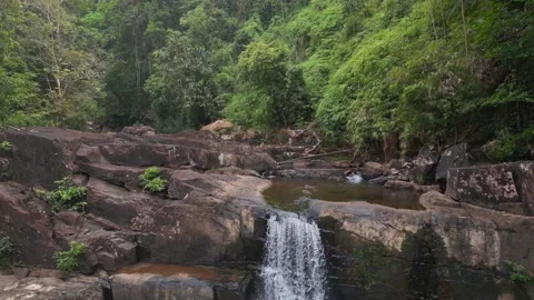 overflight edge of waterfall to the lake... | Stock Video | Pond5