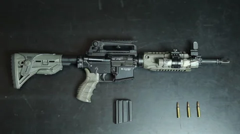 Overhead of American sniper rifle on bl... | Stock Video | Pond5