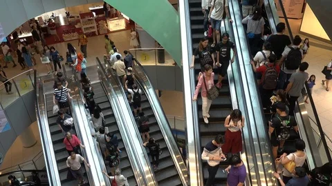 Overhead angle people moving on busy esc... | Stock Video | Pond5
