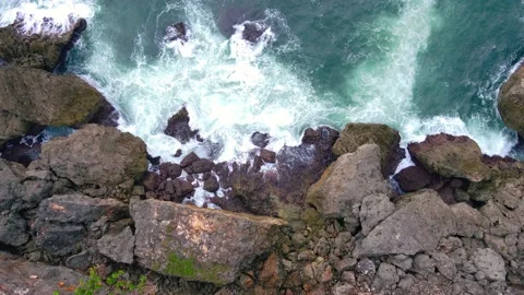Overhead drone shot of rocky beach hits ... | Stock Video | Pond5