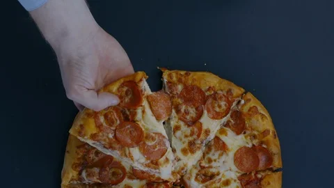 OVERHEAD Male taking pizza slice from th... | Stock Video | Pond5