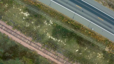 Overhead of man walking on highway next ... | Stock Video | Pond5