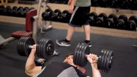 Overhead shot of bodybuilder on a bench ... | Stock Video | Pond5