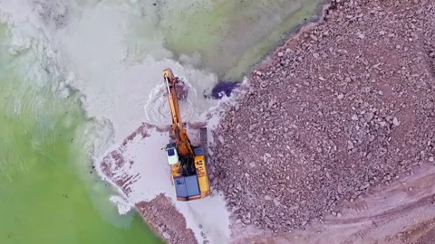 Overhead View Of Excavator Removing Ston... | Stock Video | Pond5