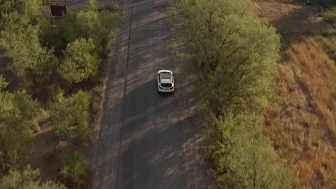 An overhead view of a white car driving ... | Stock Video | Pond5