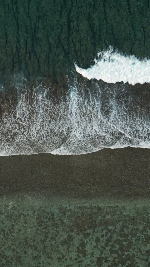 Overhead zenithal view of waves breaking... | Stock Video | Pond5