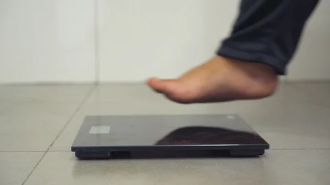 Overweight man feet standing on weight s... | Stock Video | Pond5