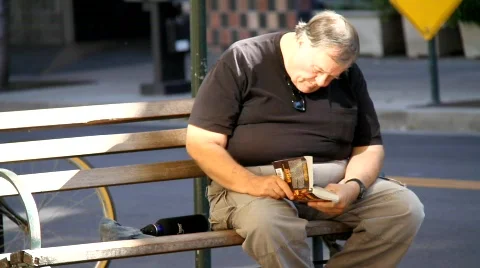 Overweight man reading book | Stock Video | Pond5