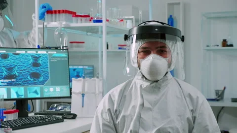 Overworked chemist sitting in equipped l... | Stock Video | Pond5