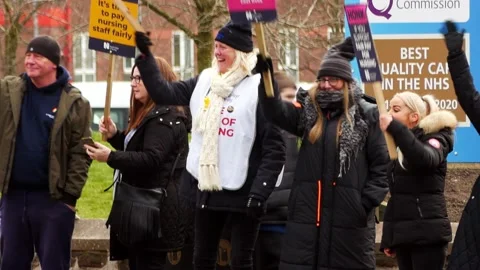 Overworked NHS staff strike on the picke... | Stock Video | Pond5