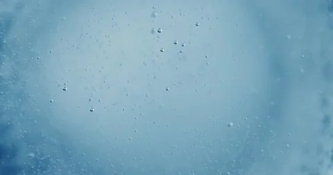 Oxygen bubbles in water on a blue abstra... | Stock Video | Pond5