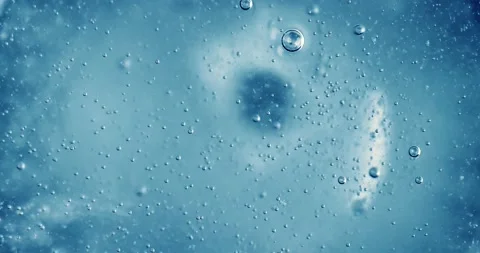 Oxygen bubbles in water on a blue abstra... | Stock Video | Pond5