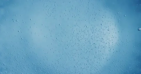 Oxygen bubbles in water on a blue abstra... | Stock Video | Pond5